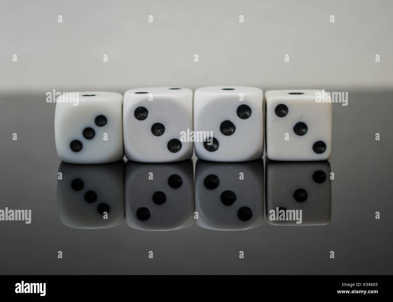 Four dices reflection Stock Photo - Alamy