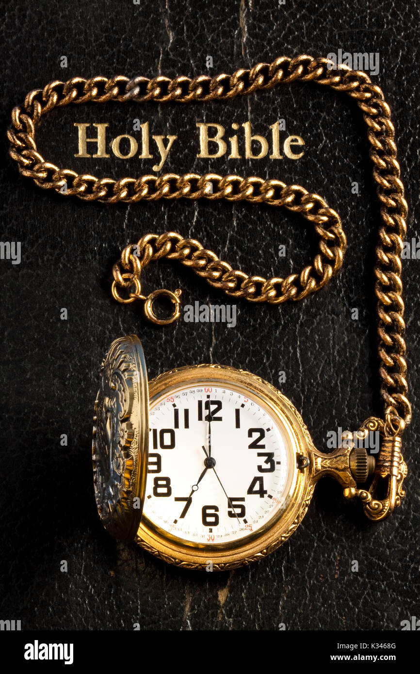 Pocket Watch On Holy Bible Stock Photo - Alamy