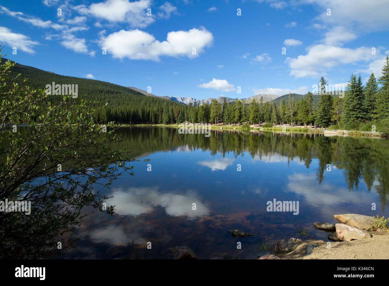 Reflective Lake In Colorado Mountains Stock Photo - Alamy