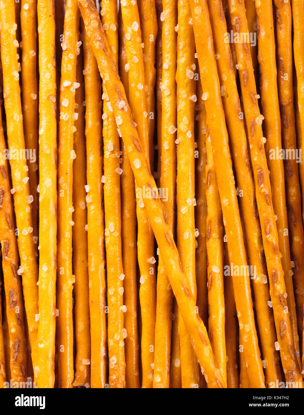 Food background from a texture of salted straws Stock Photo - Alamy