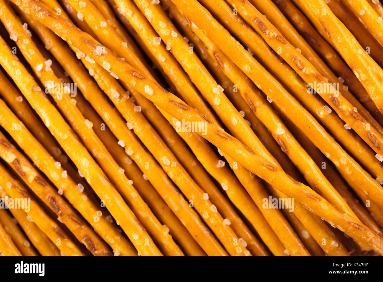 Food background from a texture of salted straws Stock Photo - Alamy