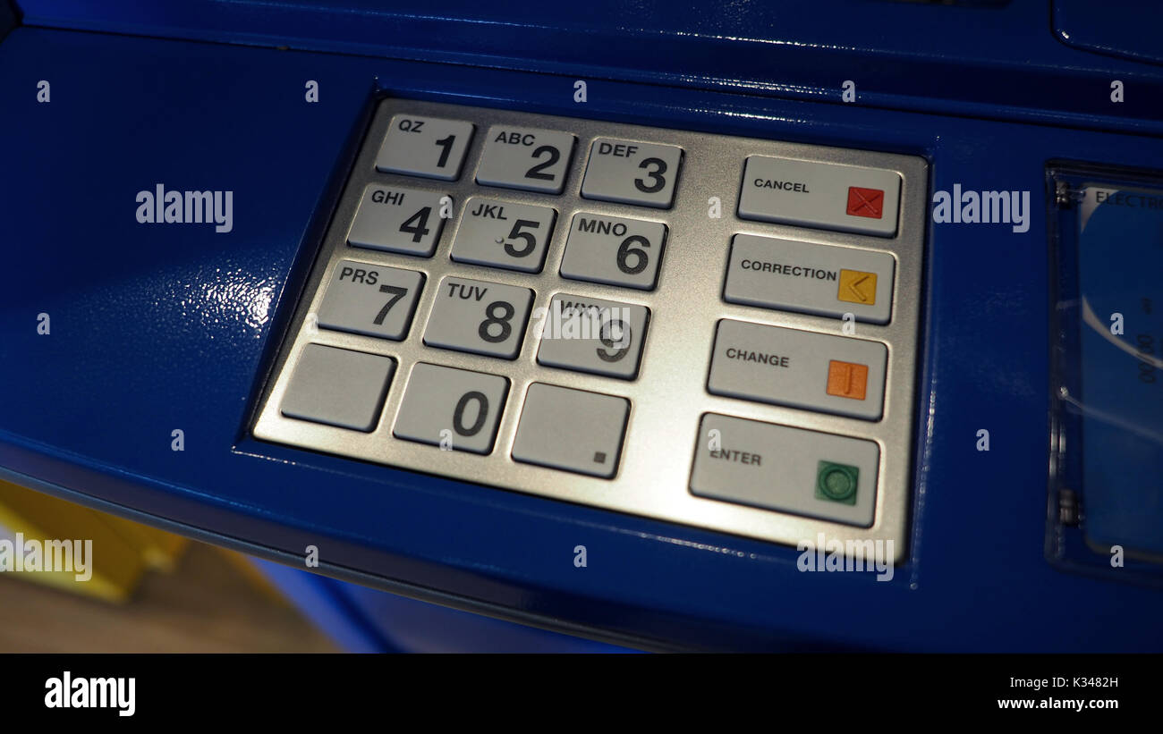 Blue color banking ATM machine and black number on white button keypad ...