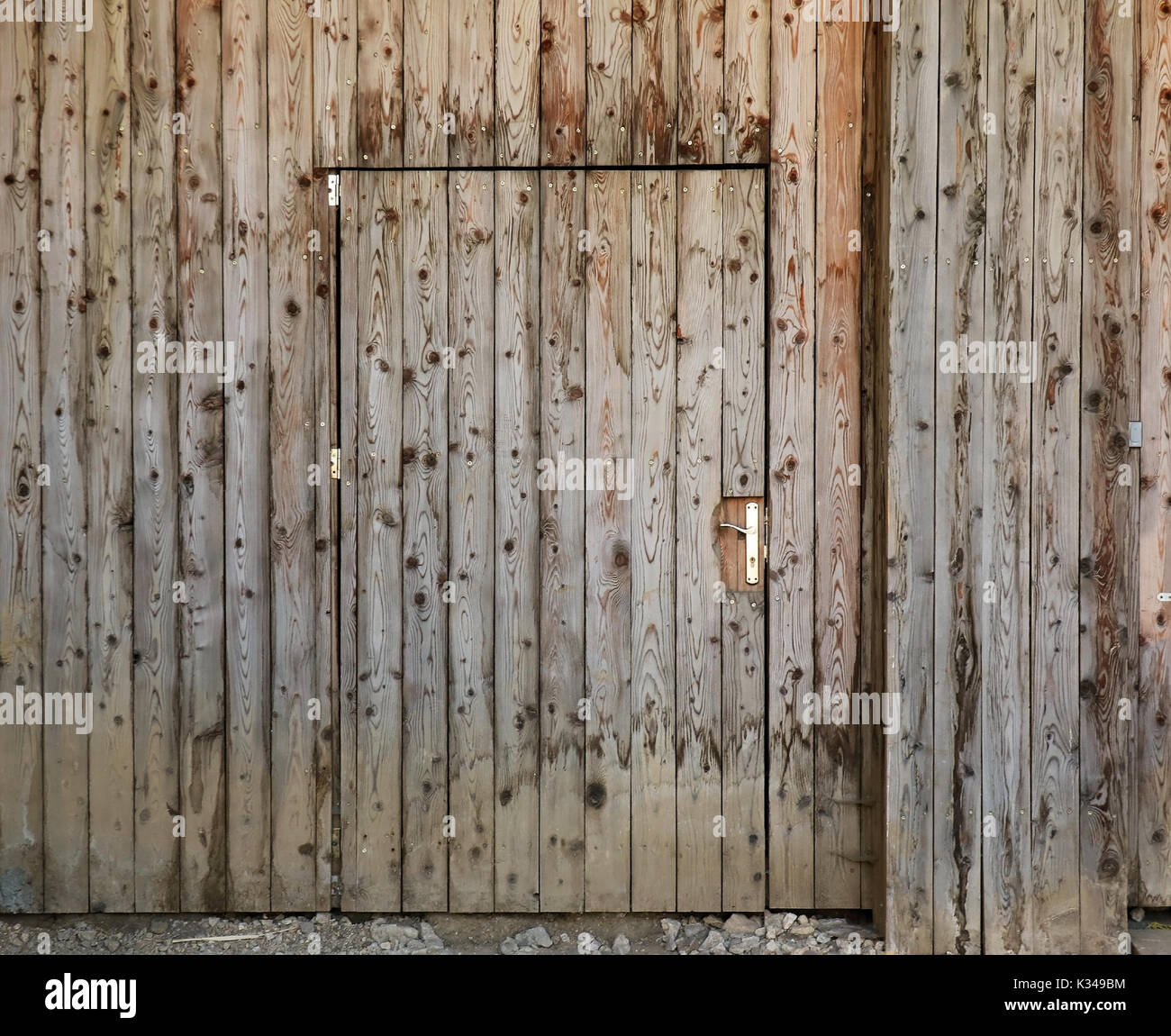 Old barn closed wooden door with wooden facade wall Stock Photo - Alamy