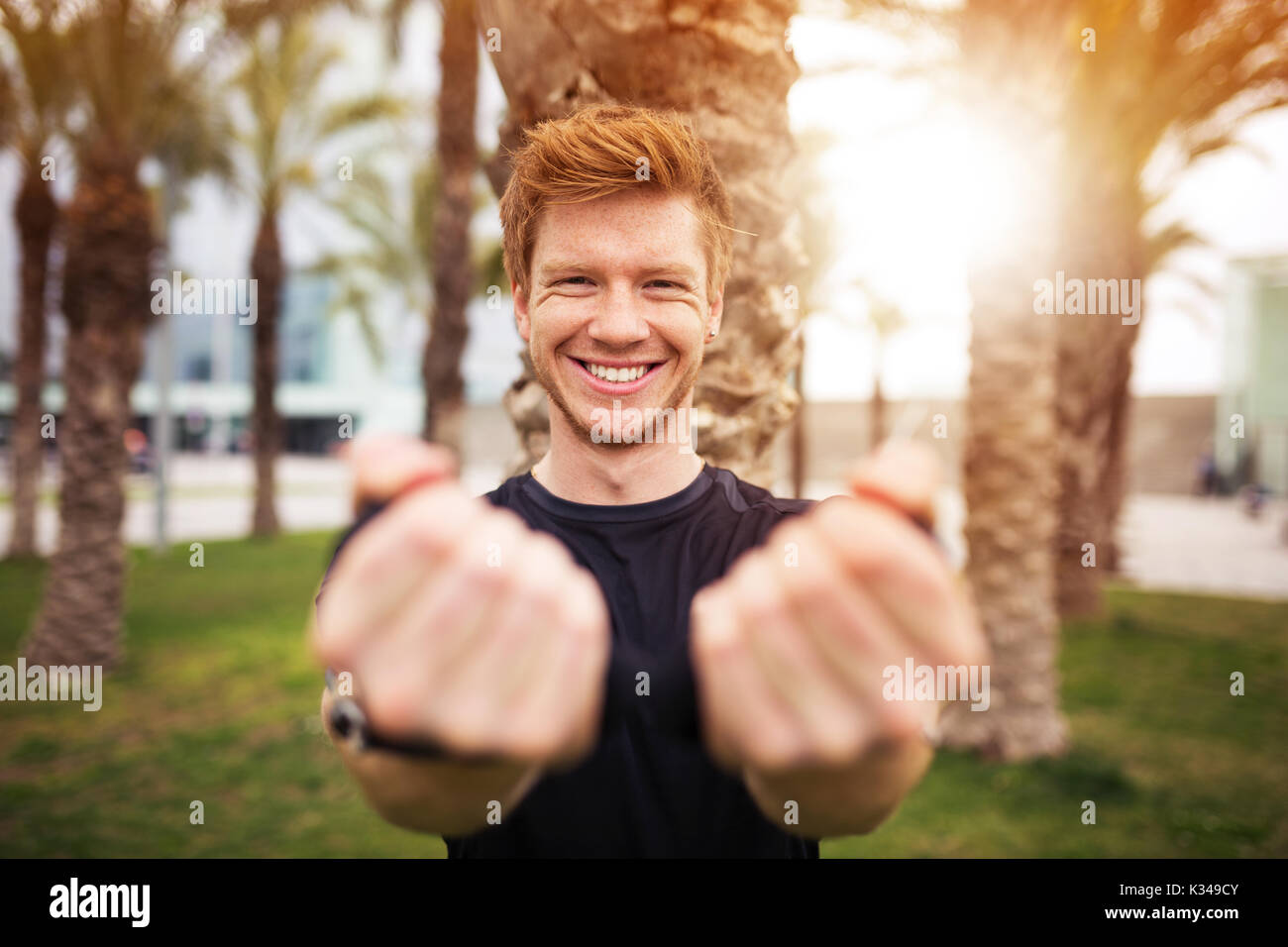 A photo of young, happy man exercising at the park to keep strong Stock ...