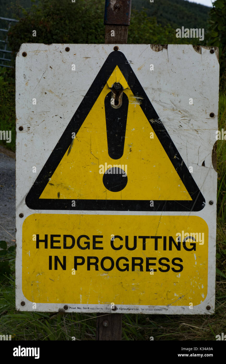 Yellow warning sign hedge cutting hi-res stock photography and images ...
