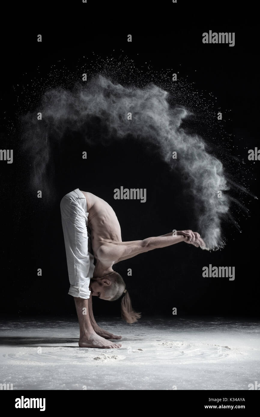 Standing forward bend pose hi-res stock photography and images - Alamy