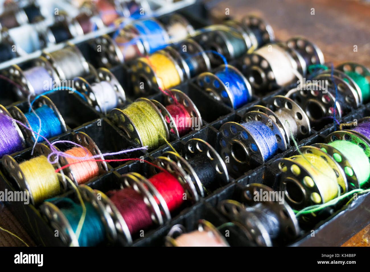Spool of colorful thread, selective focus Stock Photo - Alamy