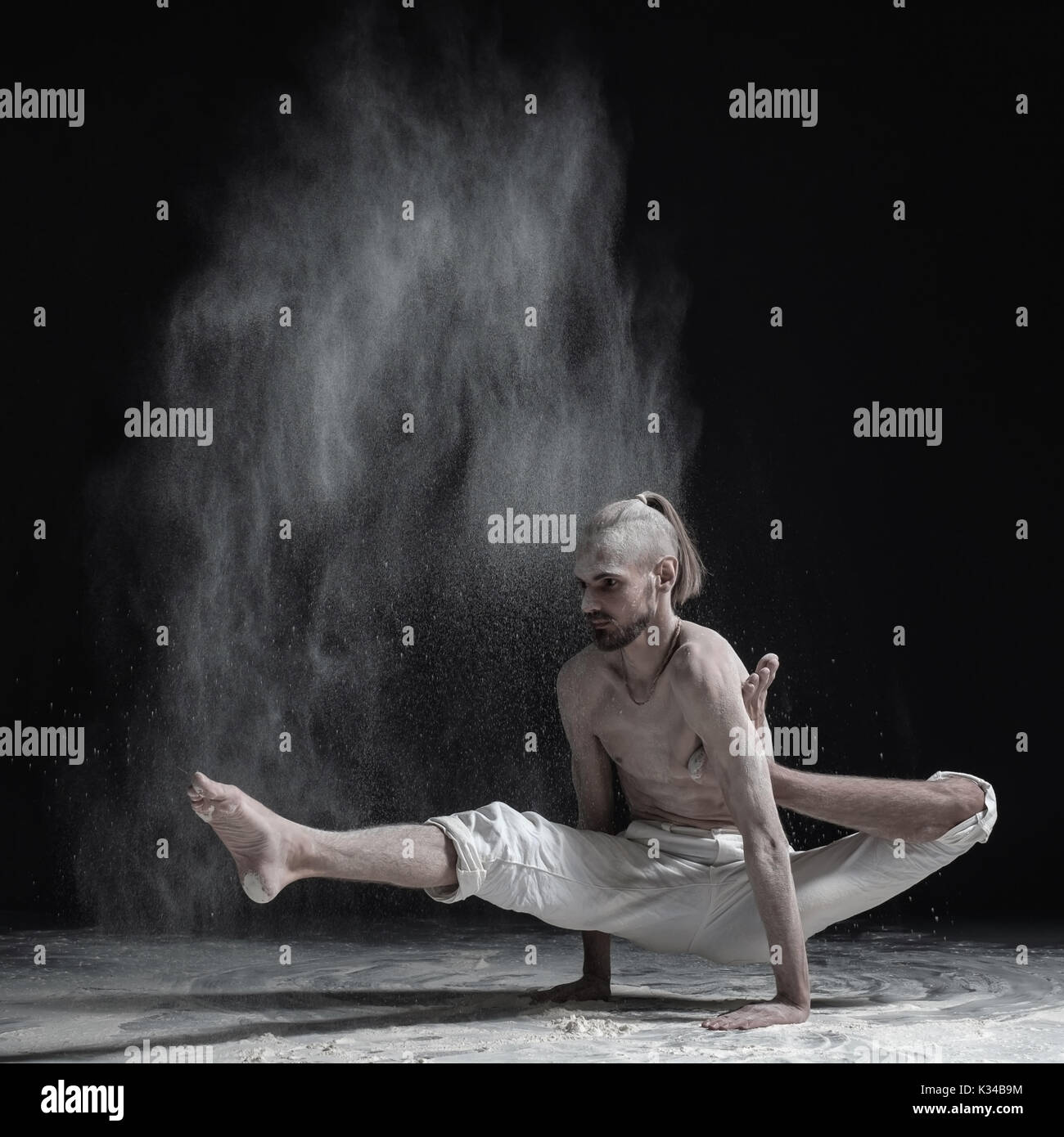 Flexible yoga man doing hand balance asana brahmachariasana Stock Photo ...