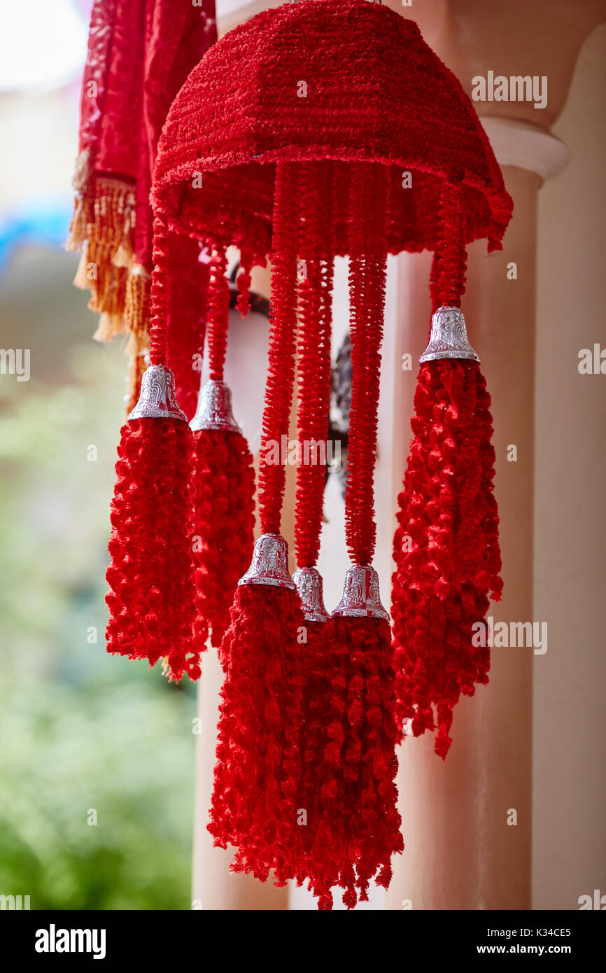 Textile decorations hanging inside Indian temple macro Stock Photo - Alamy