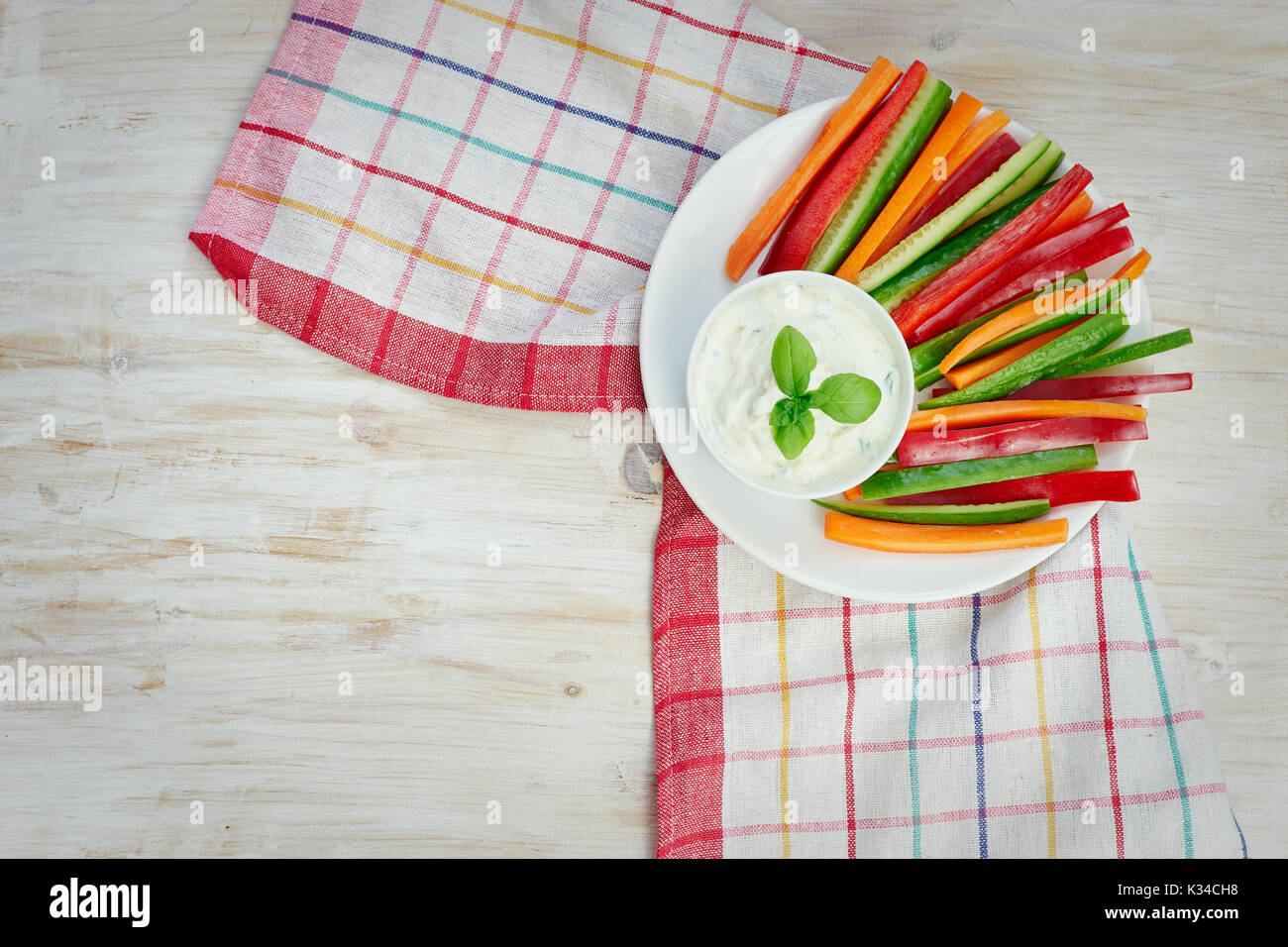 Healthy vegetable sticks on plate with dip Stock Photo - Alamy