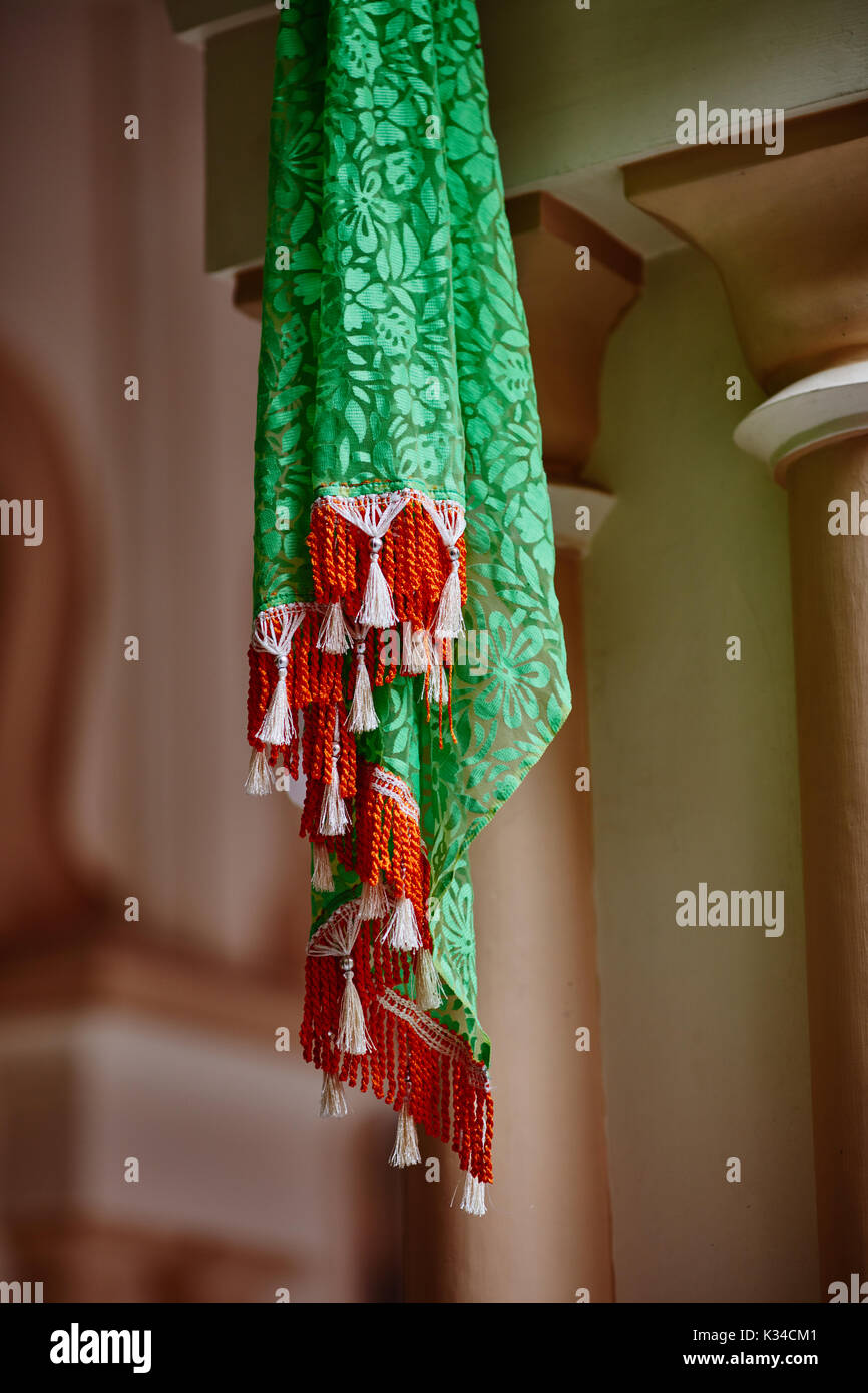 Textile decorations hanging inside Indian temple macro Stock Photo - Alamy
