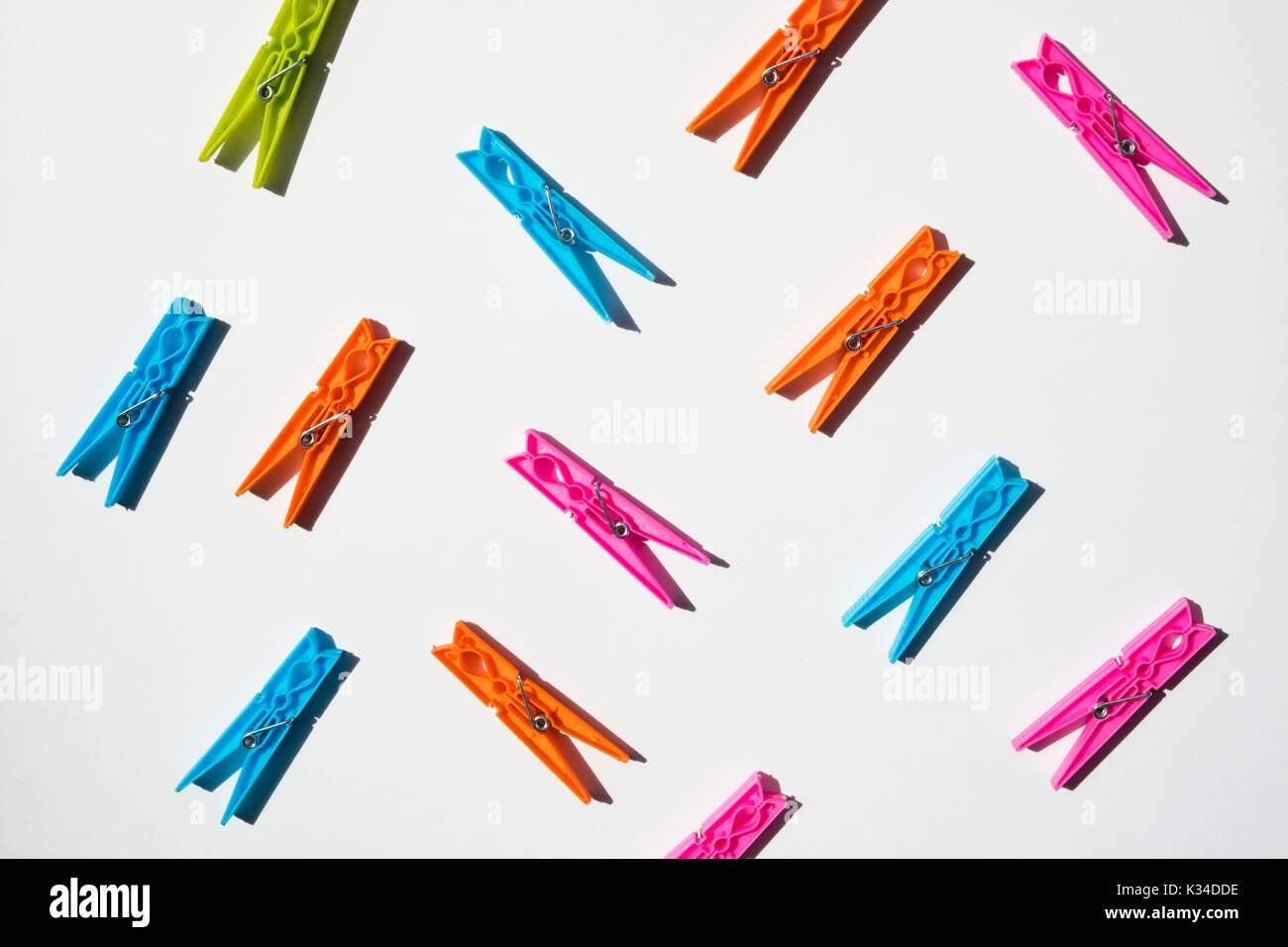 Group of clothes pegs on in white isolated background Stock Photo - Alamy