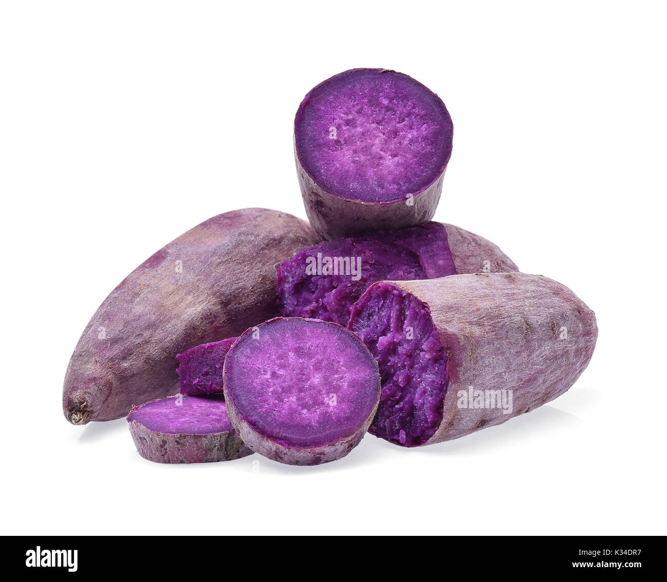 Purple Sweet Potatoes on White background Stock Photo - Alamy
