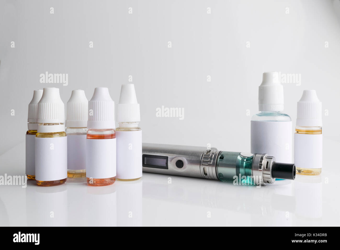 Isolated electronic cigarette with e-liquid or e-juice on a white ...