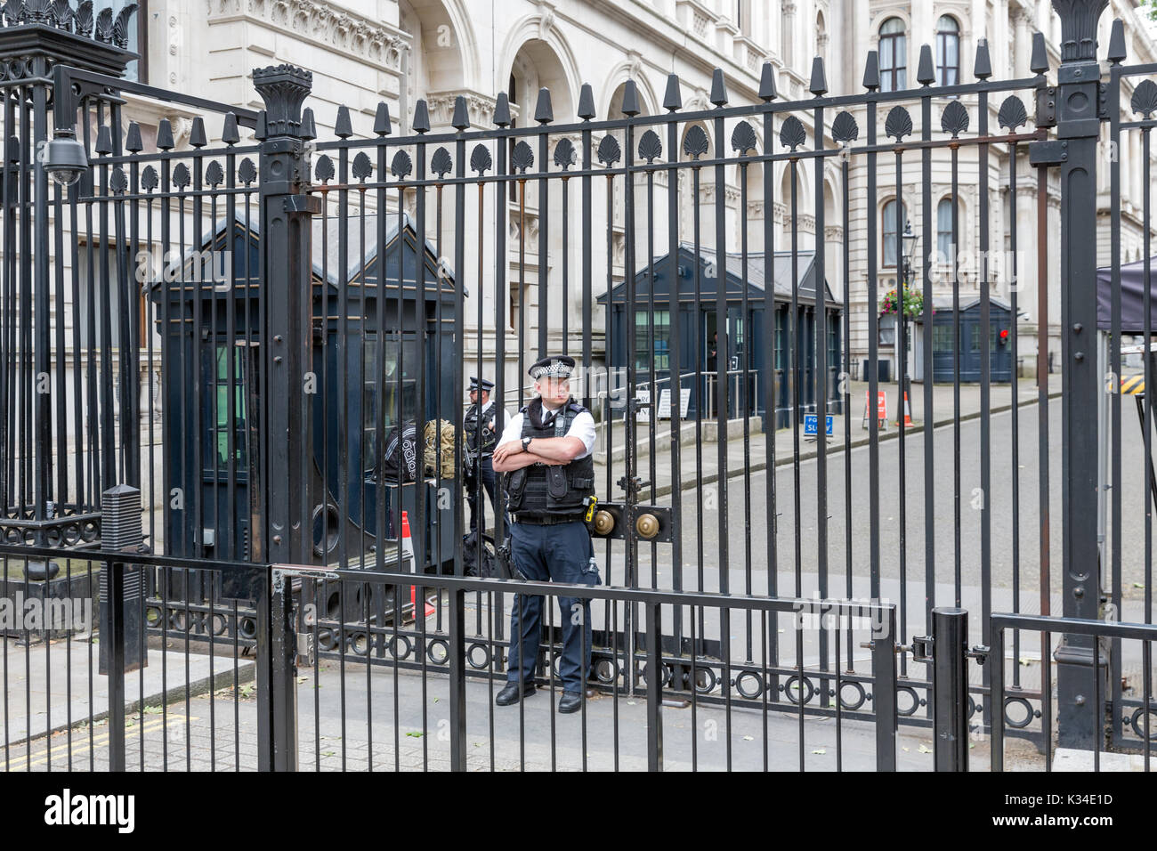 LONDON, ENGLAND - JUNE 08, 2017: Police officers guards the gate of ...