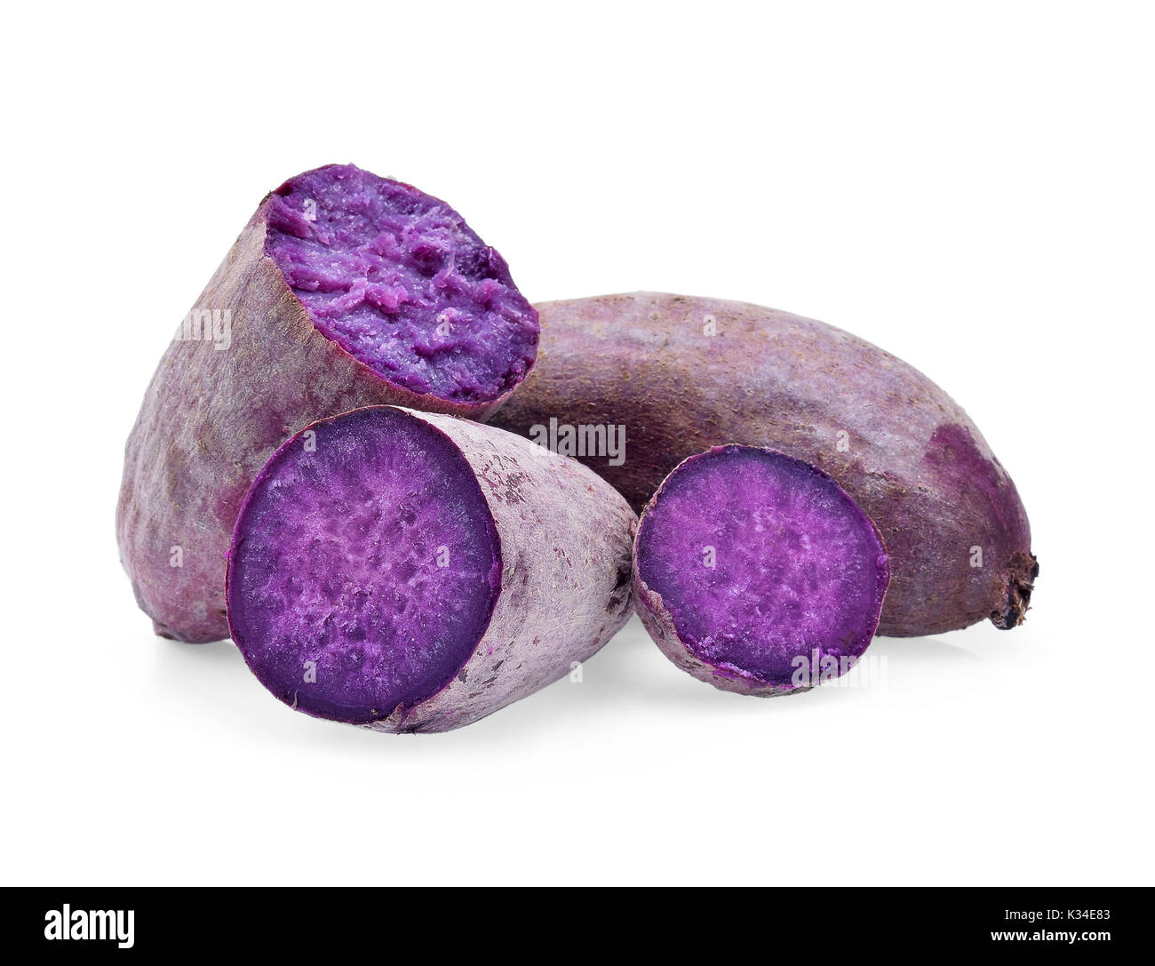 Purple Sweet Potatoes on White background Stock Photo - Alamy