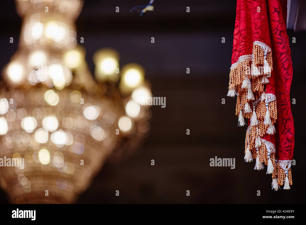 Textile decorations hanging inside Indian temple macro Stock Photo - Alamy