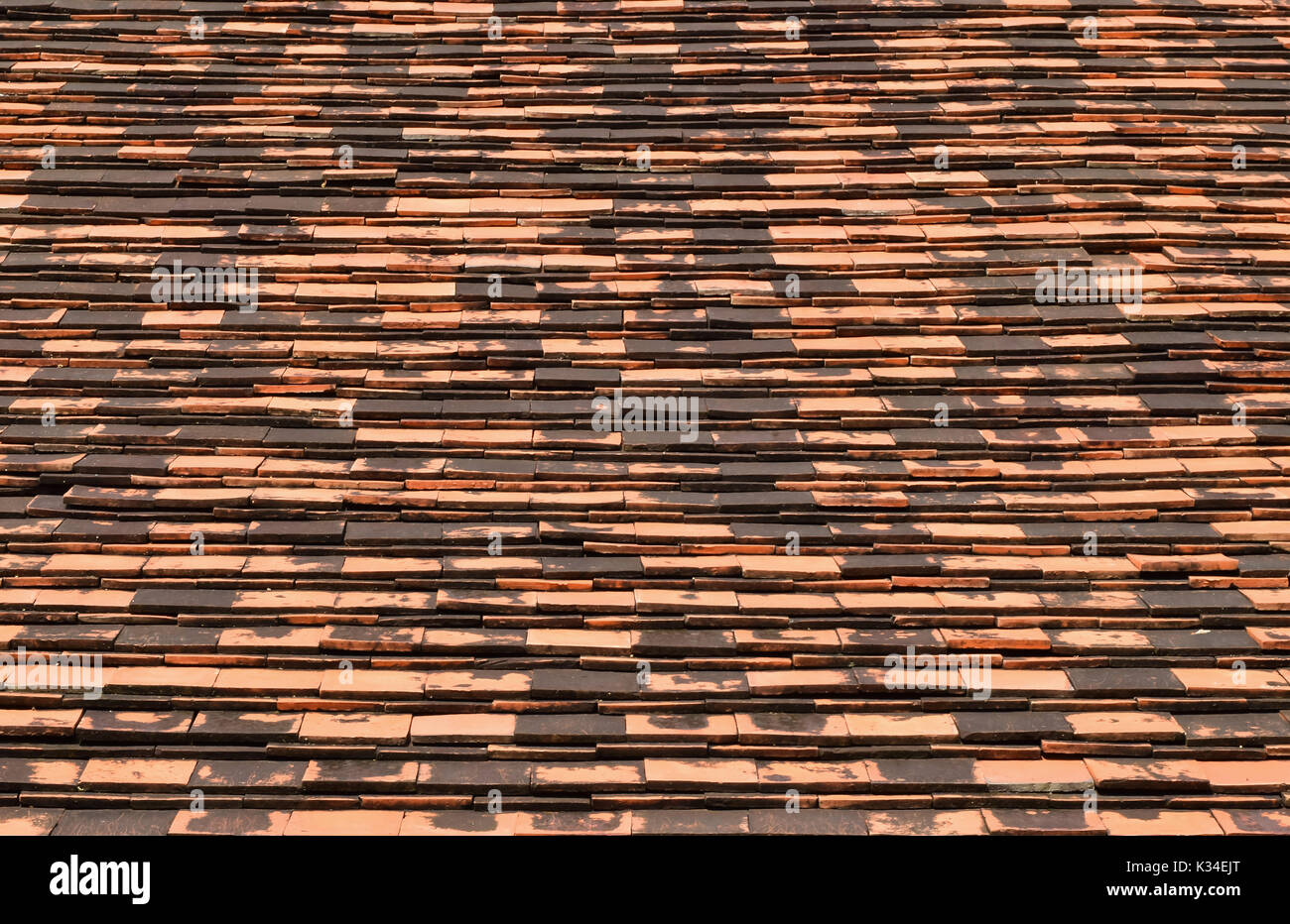 Old brick roof tiles background Stock Photo - Alamy
