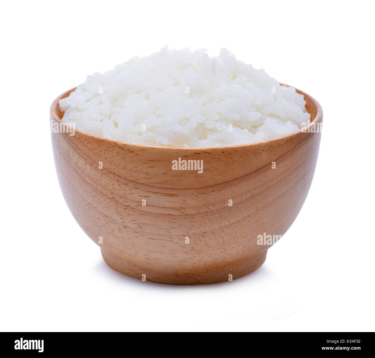 rice in wooden bowl on white background Stock Photo - Alamy