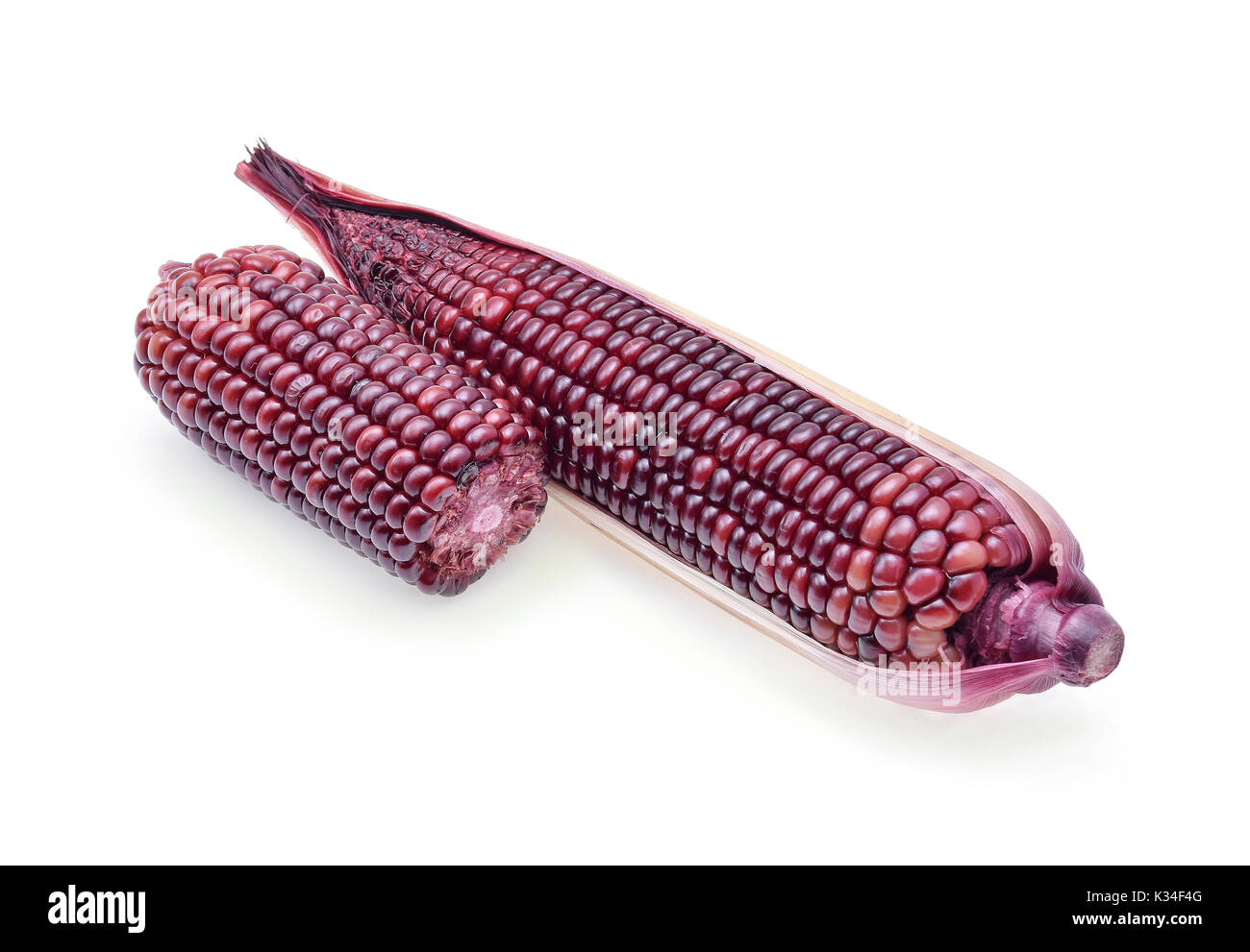ripe purple corn isolate on white background Stock Photo - Alamy