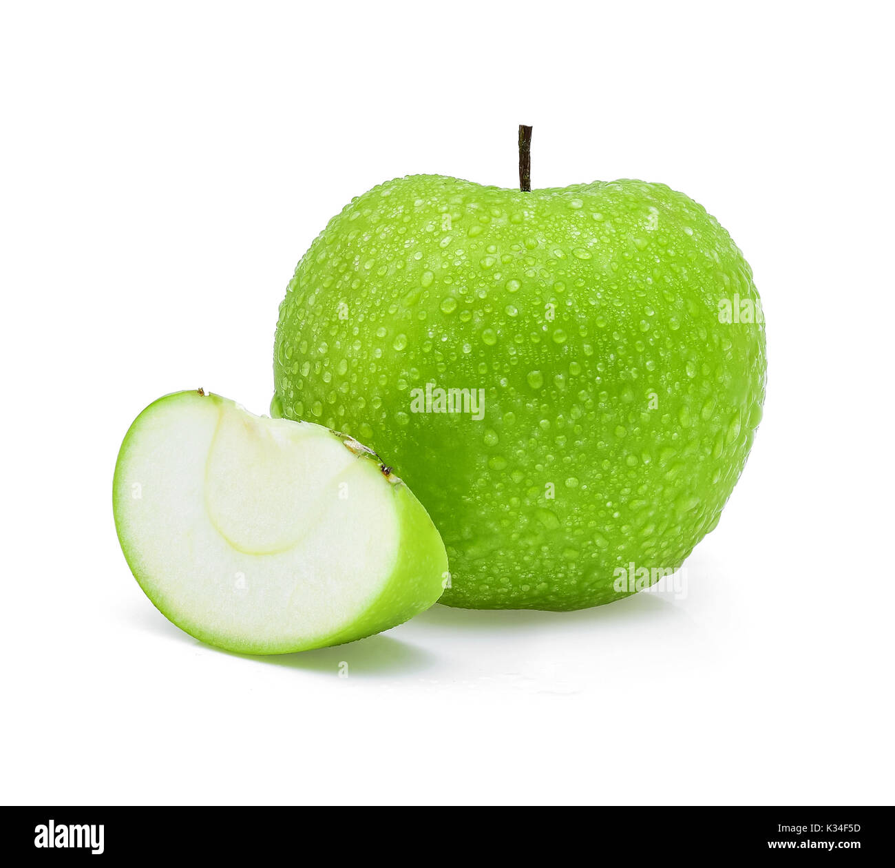 Drop of water green apple on white background Stock Photo - Alamy