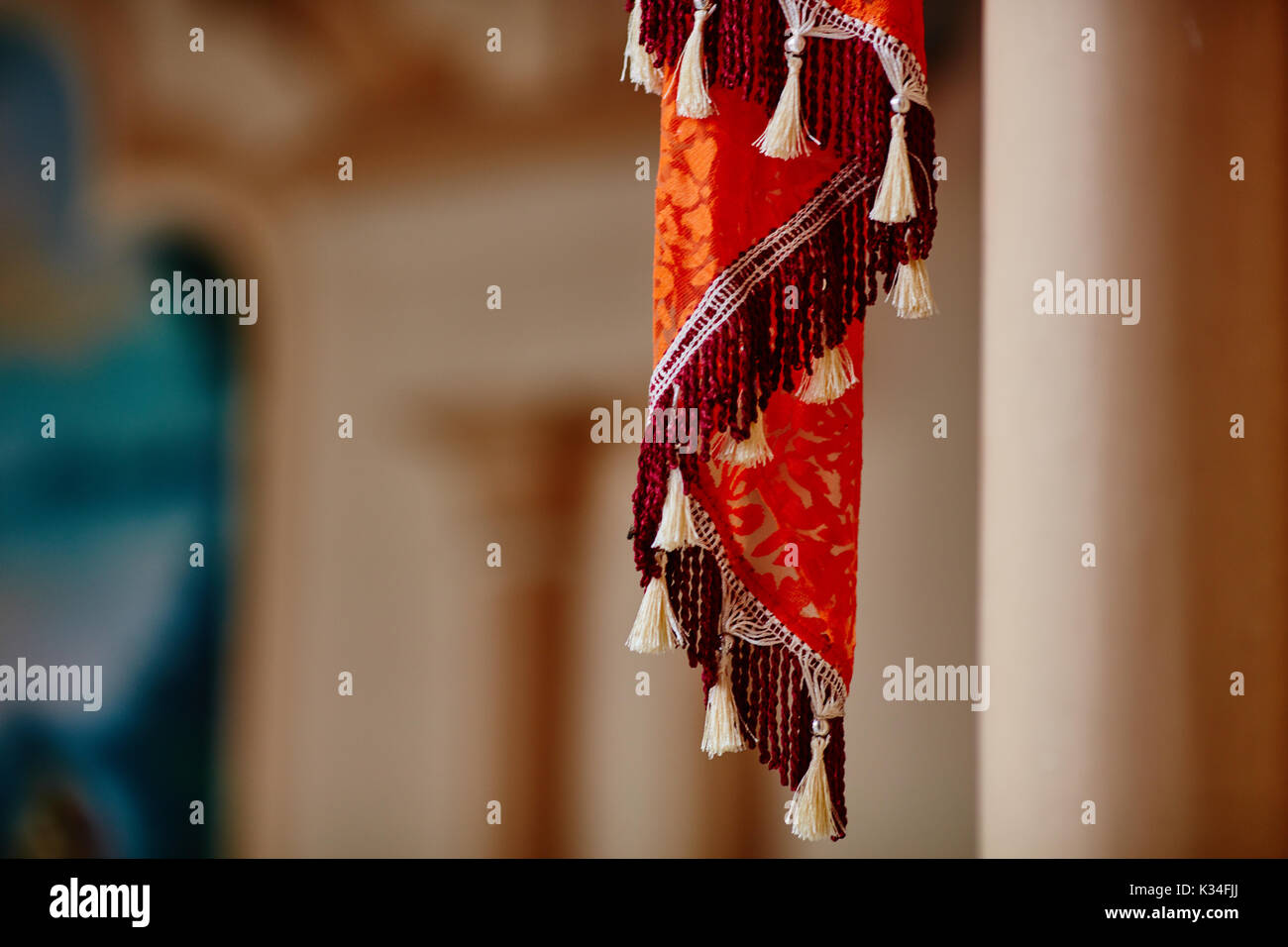 Textile decorations hanging inside Indian temple macro Stock Photo - Alamy