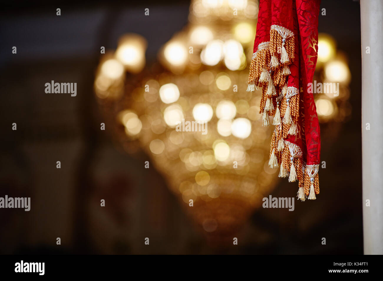 Textile decorations hanging inside Indian temple macro Stock Photo - Alamy