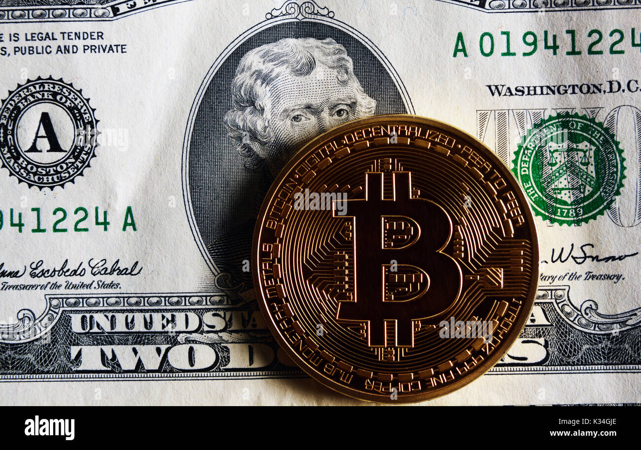 Bitcoin on two dollar banknote. Trading concept Stock Photo - Alamy