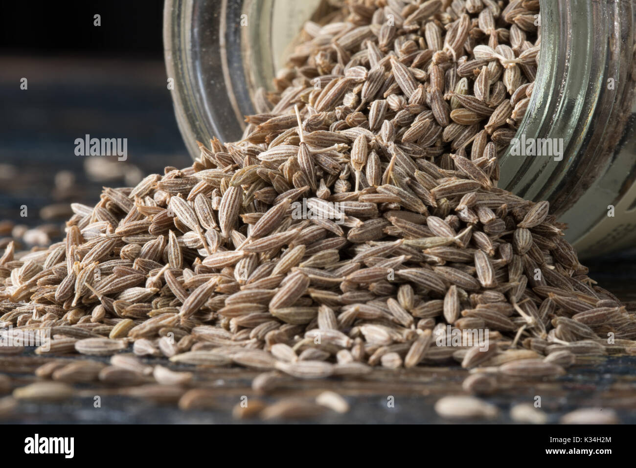 Cumin Seeds Spilled from a Jar Stock Photo - Alamy