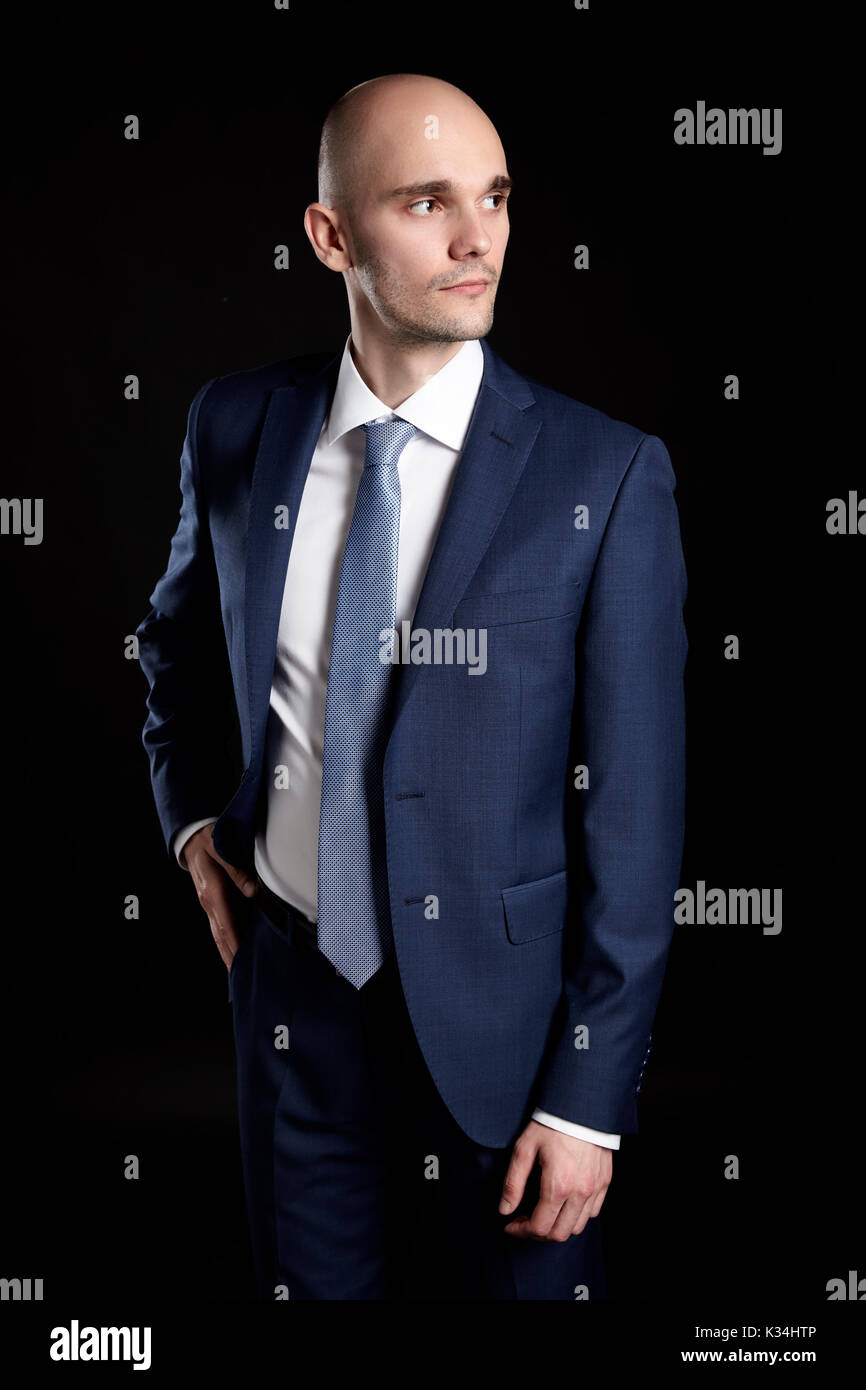 Portrait of elegant man looking left. Man on black background Stock ...