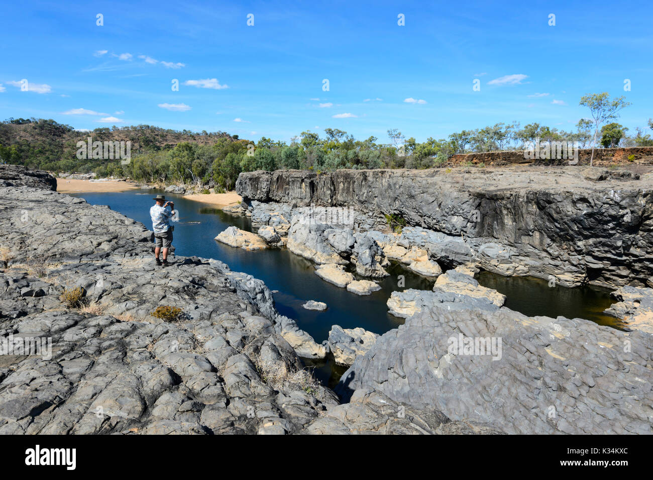 A tourist taking a picture of Copperfield Gorge on the Copperfield ...
