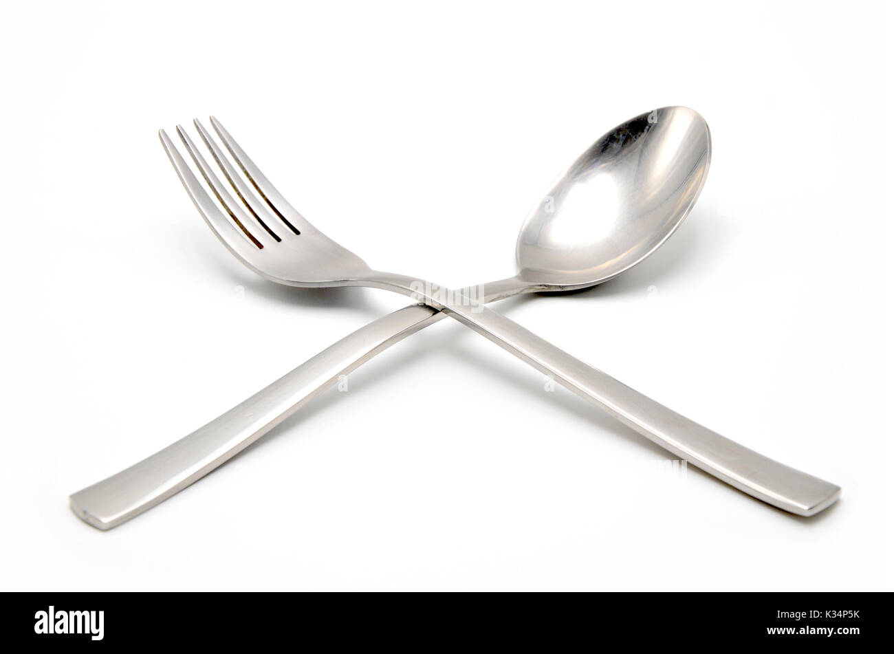 fork and spoon on white background Stock Photo - Alamy