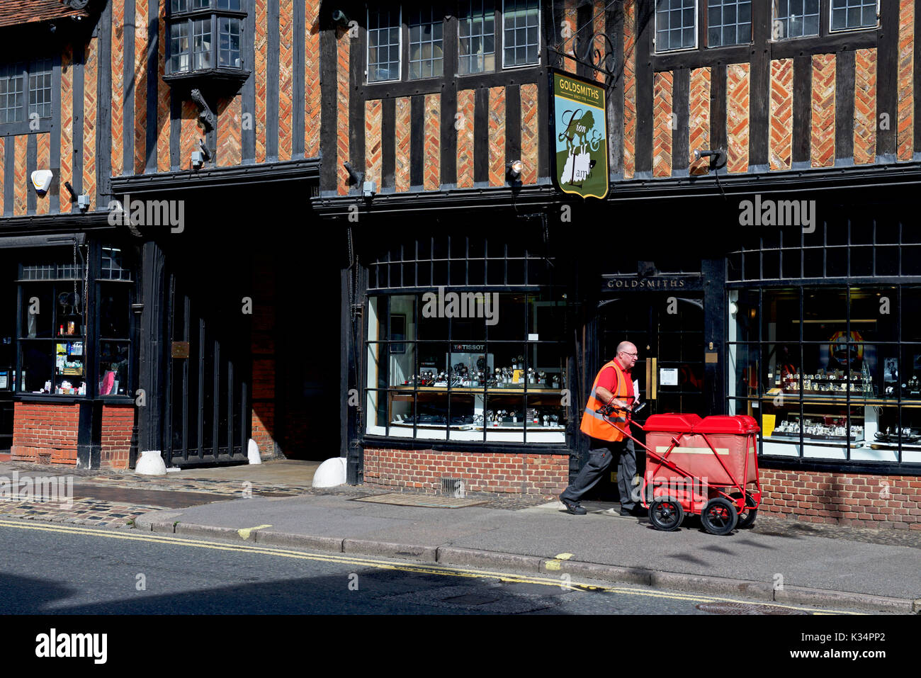 Postman delivering mail in Farnham, Hampshire, England UK Stock Photo ...