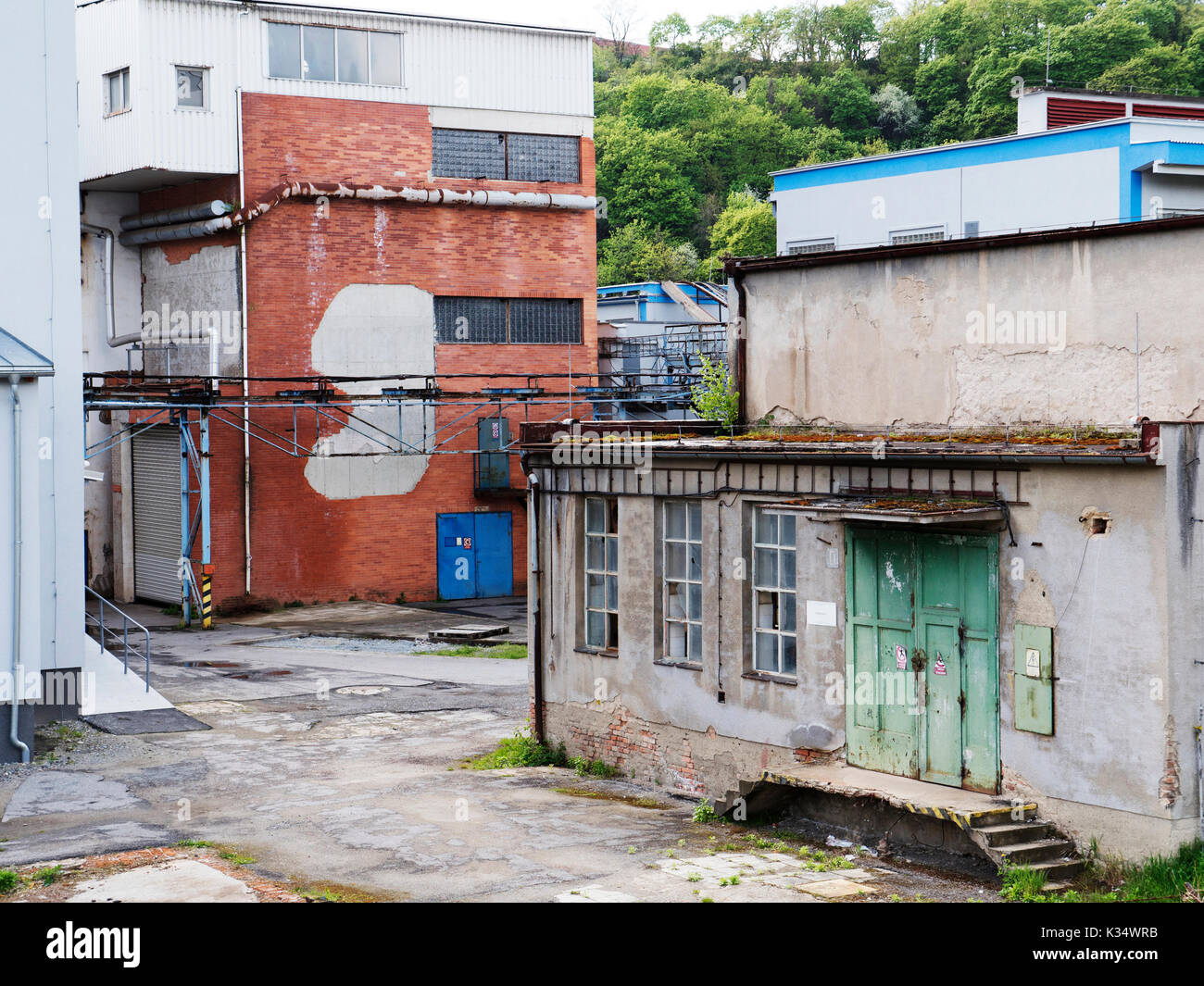 Factory building with water reservoir. Daylight, cloudy sky, the site ...