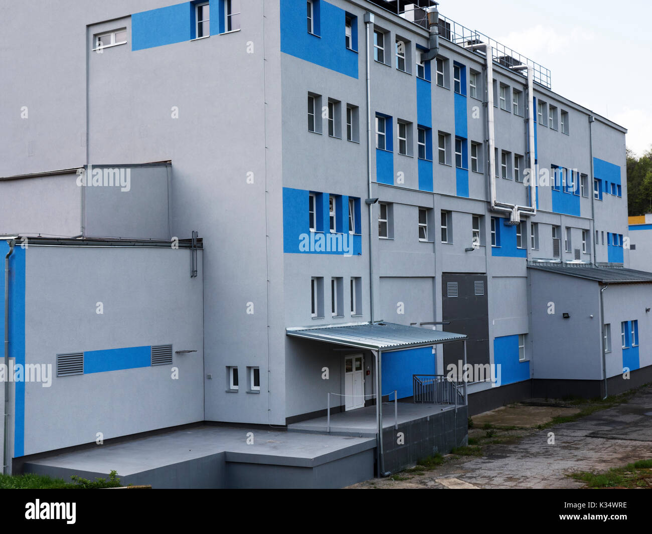 Factory building with water reservoir. Daylight, cloudy sky, the site ...