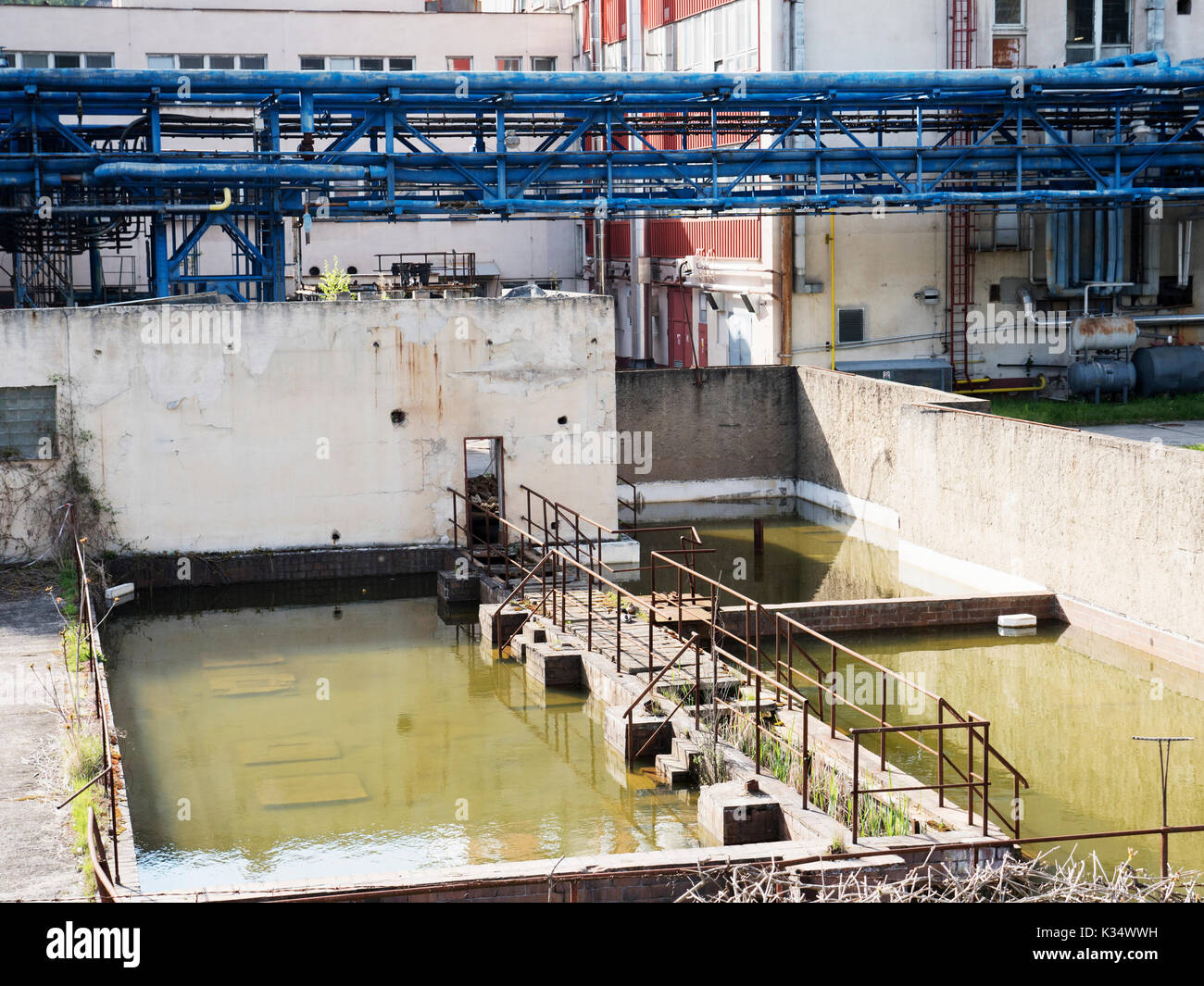 Factory building with water reservoir. Daylight, cloudy sky, the site ...