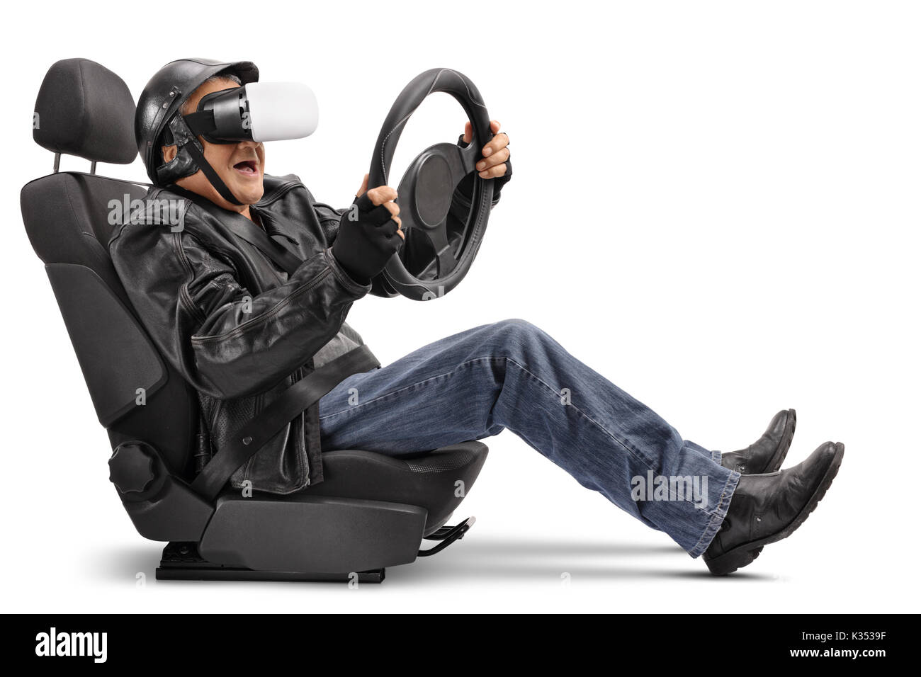 Elderly biker sitting in a car seat and using a VR headset isolated on ...
