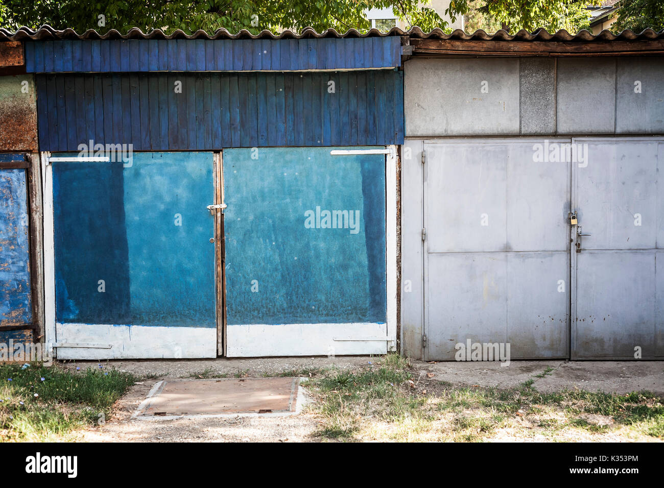 Old weathered and worn out garage door, natural light Stock Photo - Alamy