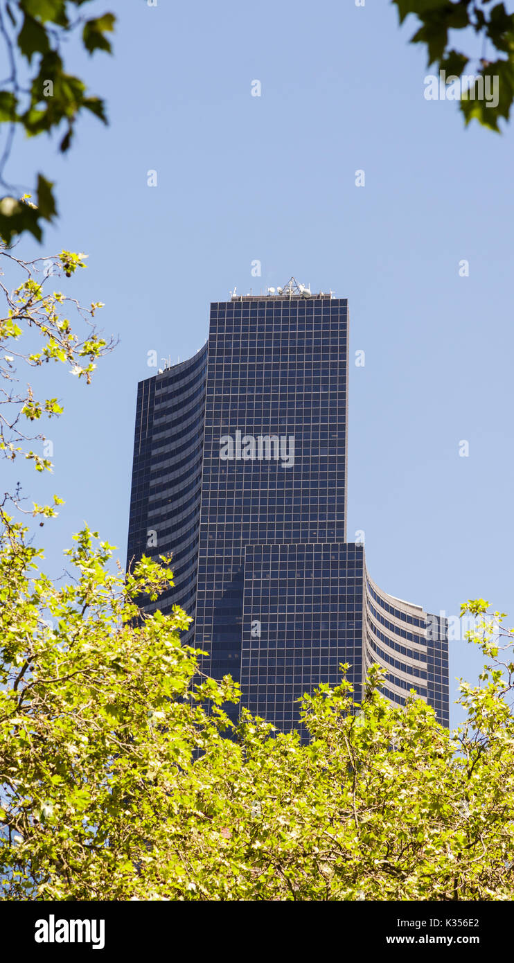 Black Modern Curved Tower in Seattle Through Trees Stock Photo - Alamy