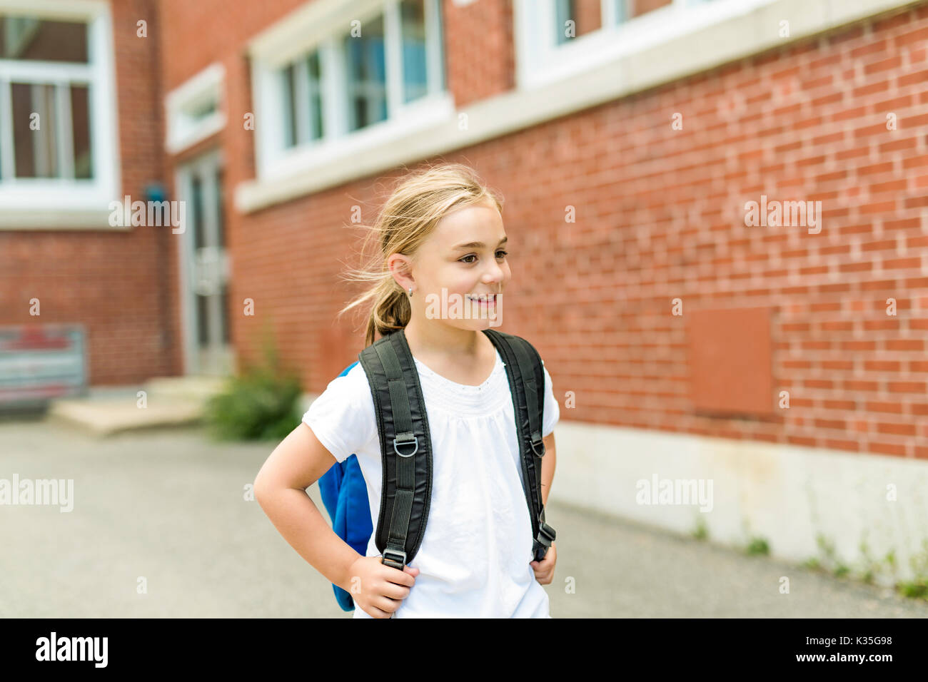 A eight years old school girl close to the schoolyards Stock Photo - Alamy