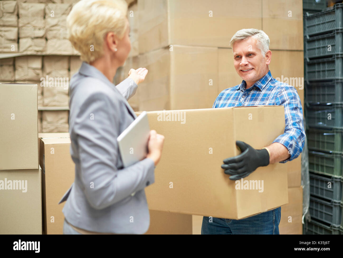 Please, put this box on the place Stock Photo - Alamy