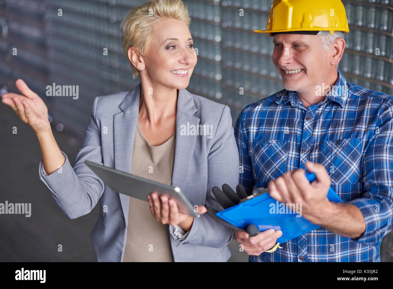 Warehouse manager looking clipboard hi-res stock photography and images ...