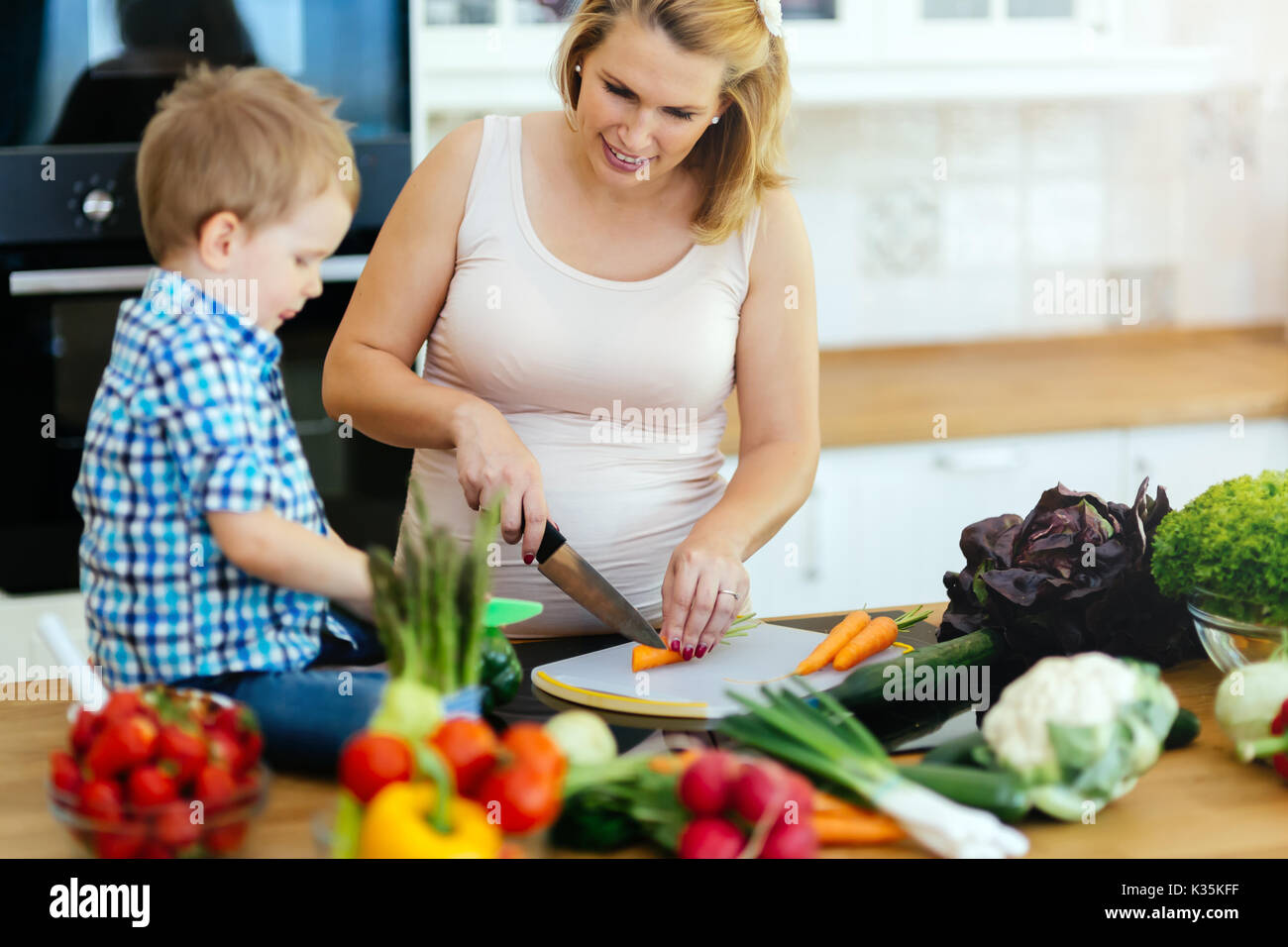 Mother and child preparing lunch Stock Photo - Alamy