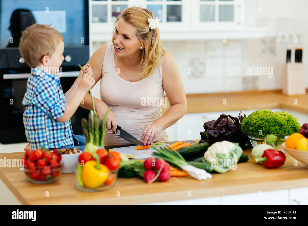 Mother and child preparing lunch Stock Photo - Alamy