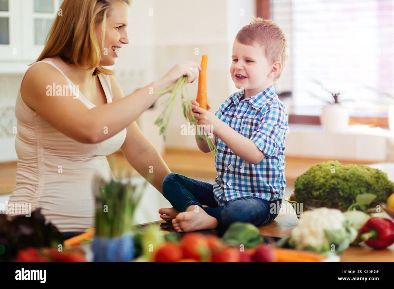 Mother and child preparing lunch Stock Photo - Alamy