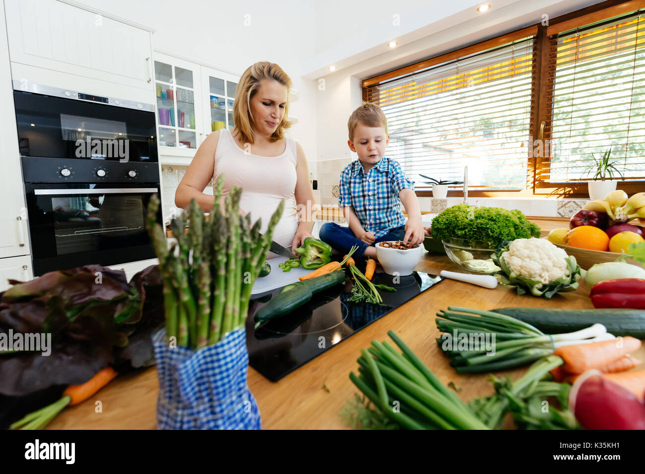 Mother and child preparing lunch Stock Photo - Alamy