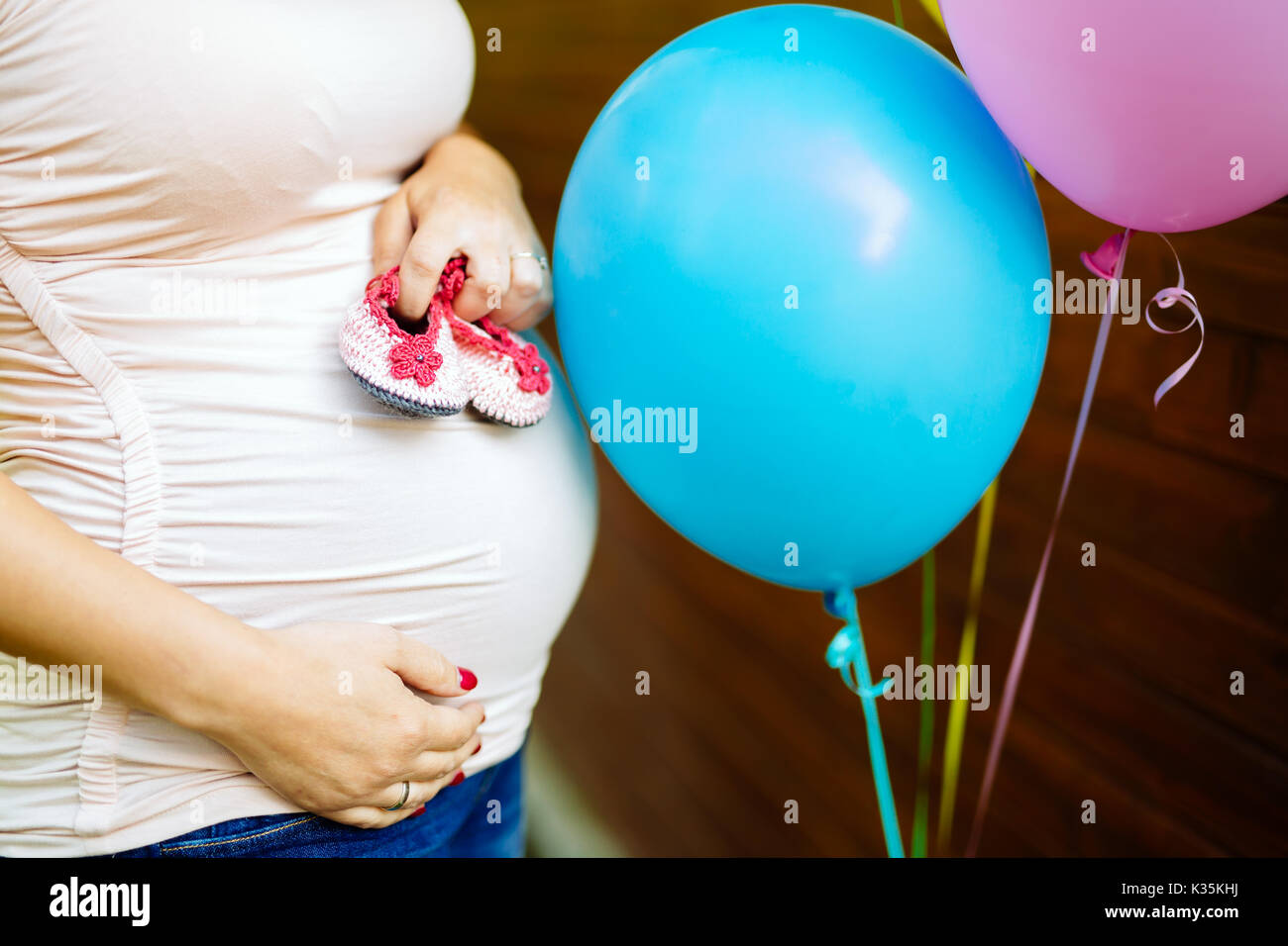 Pregnant woman expecting a girl Stock Photo - Alamy