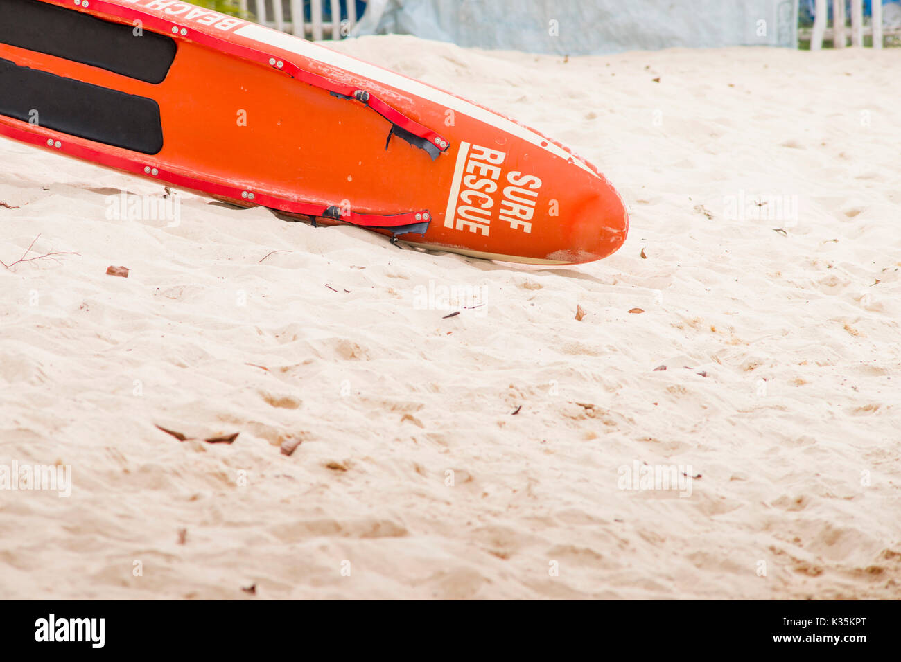 red color surf rescue board on the empty sand beach Stock Photo - Alamy