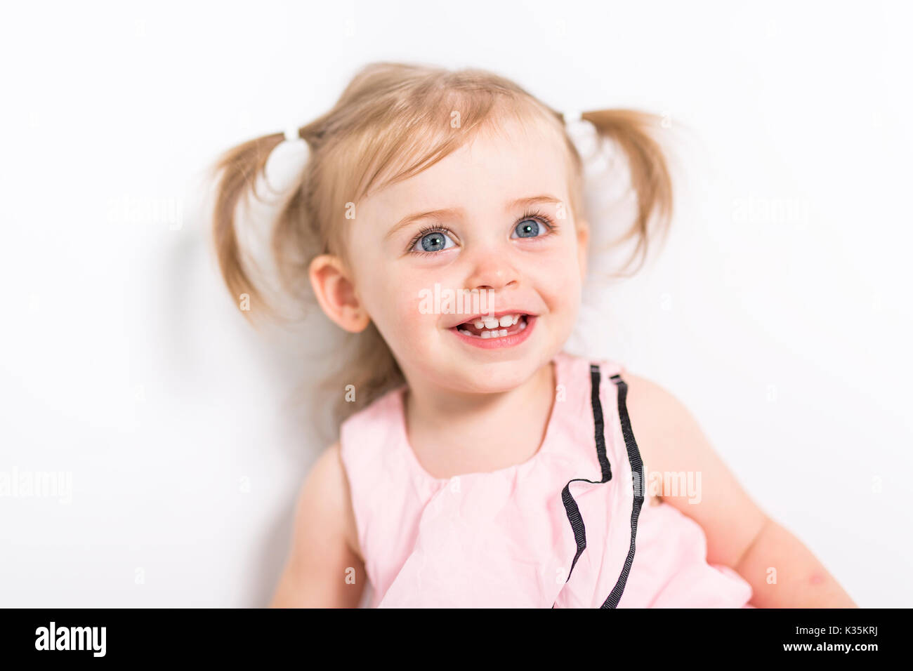 A Portrait of a 2 year old girl isolated on white background Stock ...