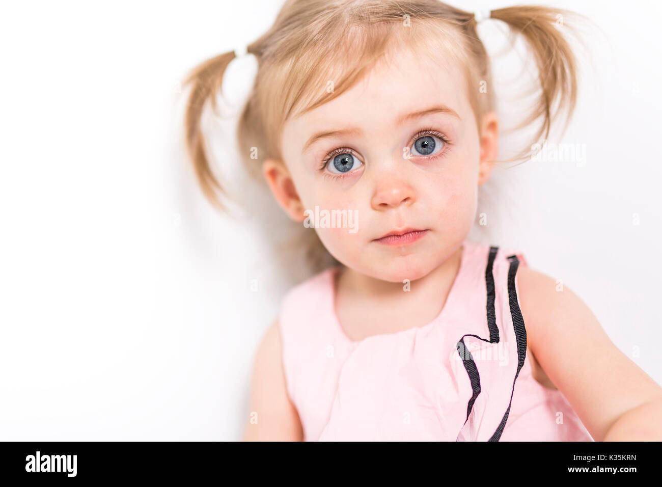 A Portrait of a 2 year old girl isolated on white background Stock ...